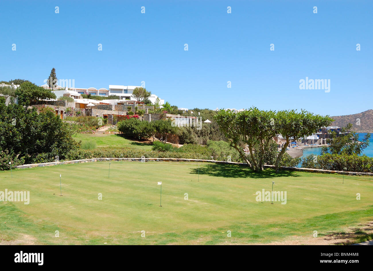 Golf field and tree at luxury hotel, Crete, Greece Stock Photo - Alamy