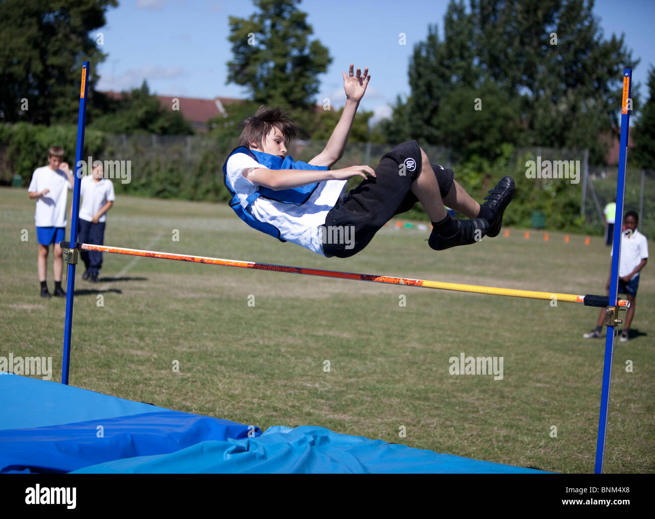 A boy high jumping Stock Photo - Alamy