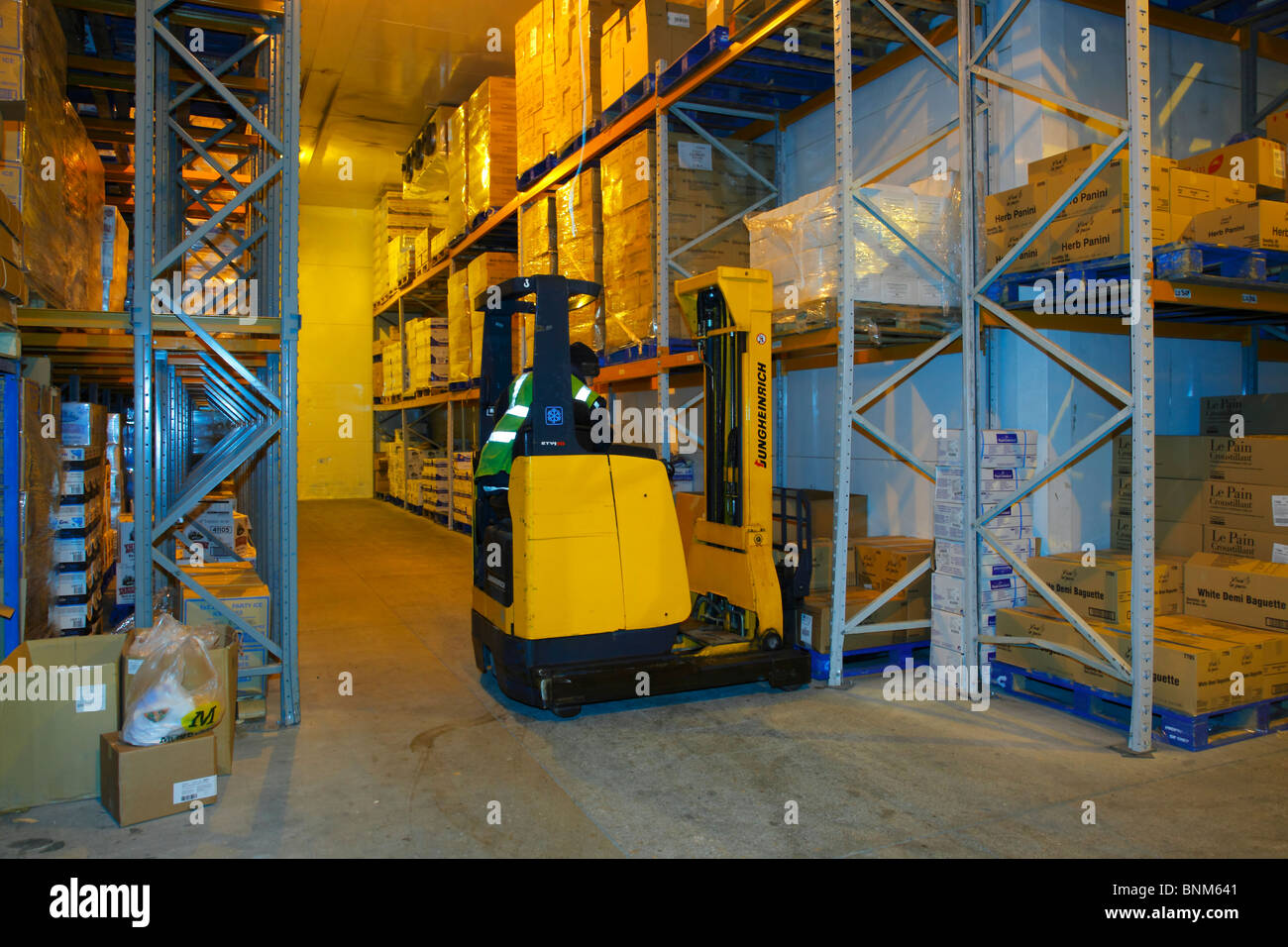 Fork Lift Truck operating in a frozen goods warehouse Stock Photo - Alamy