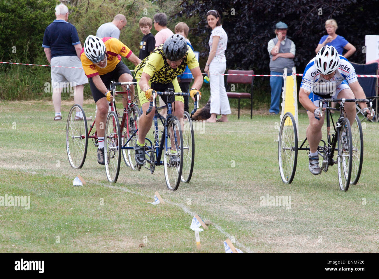 Tricycle grass track racing in a pleasantly rural location Stock Photo ...