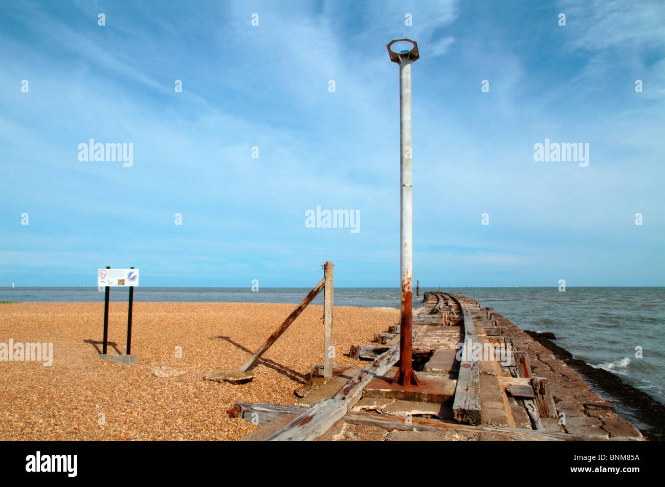 An old wooden jetty and beach at Landguard Point Suffolk England Stock ...