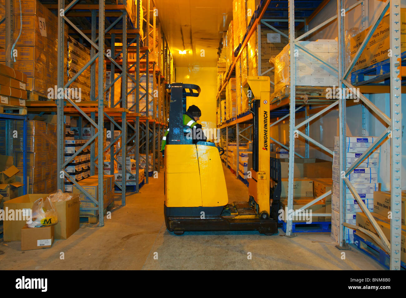 Fork Lift Truck operating in a frozen goods warehouse Stock Photo - Alamy