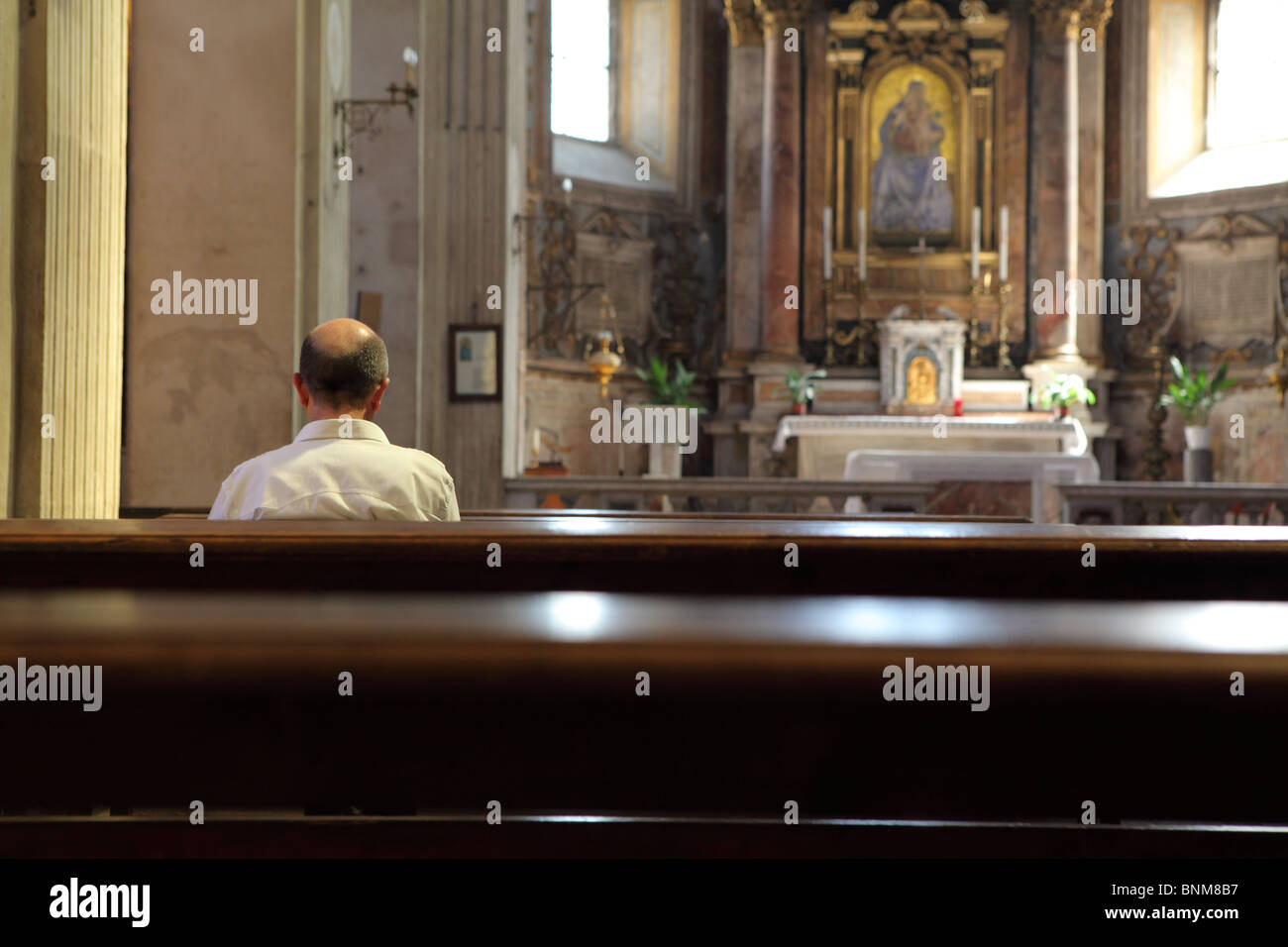 Man praying in church hi-res stock photography and images - Alamy