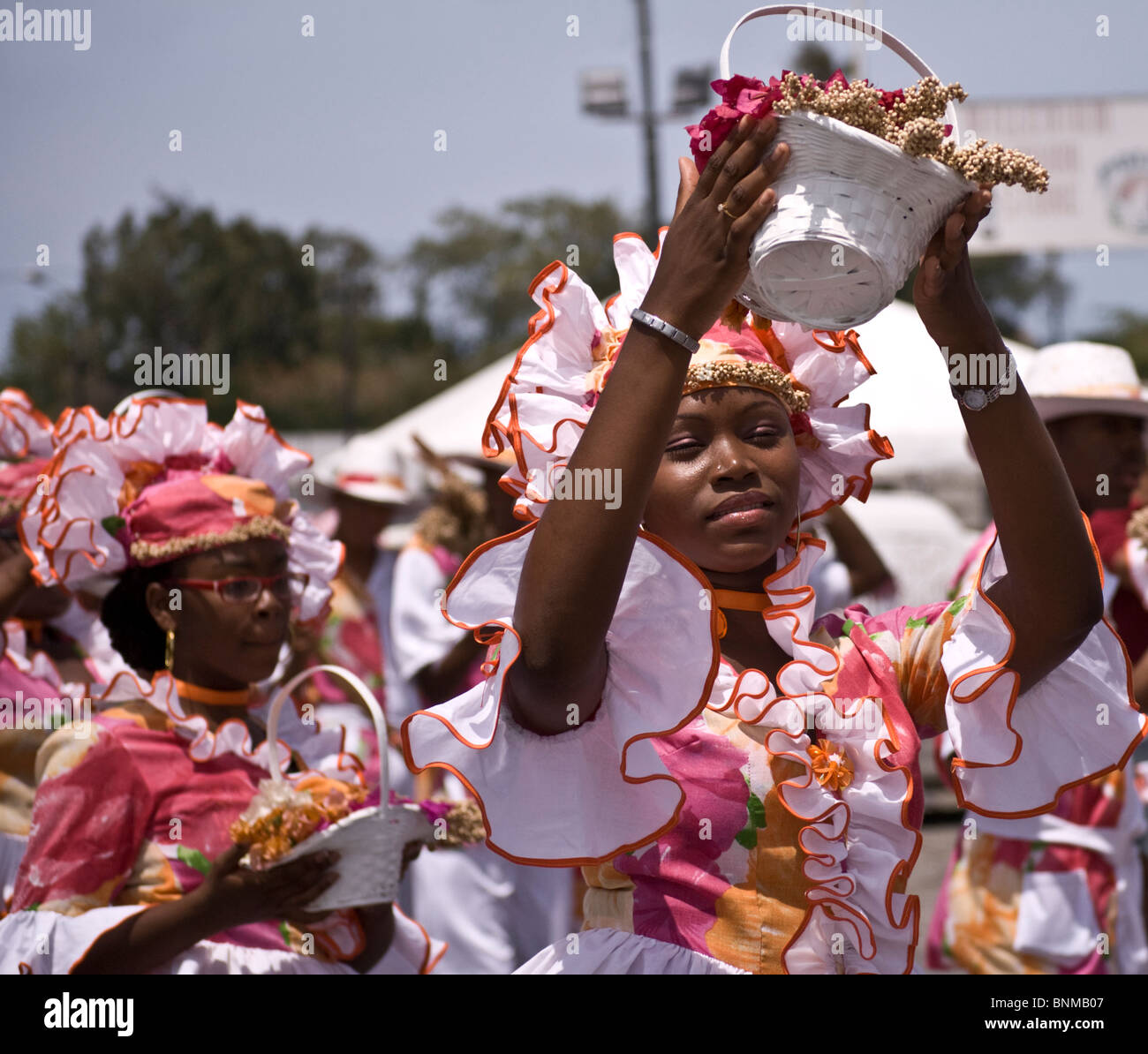 Local attractive women dancing in the street parade during the unique ...