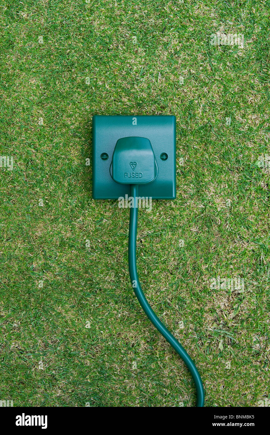 Green electric saving plug in hi-res stock photography and images - Alamy