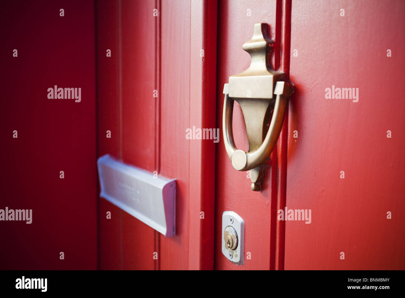 door knob in red door Stock Photo - Alamy