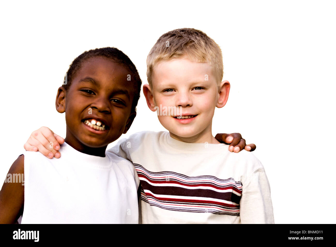 Two young boys posing for the camera with there arms around each other ...