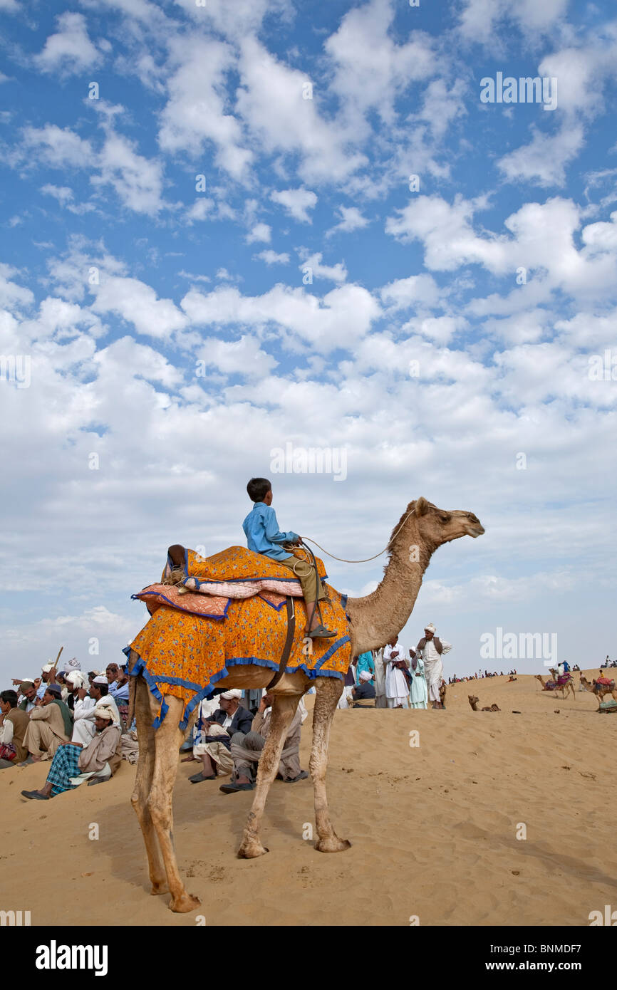 Boy riding camel hi-res stock photography and images - Alamy