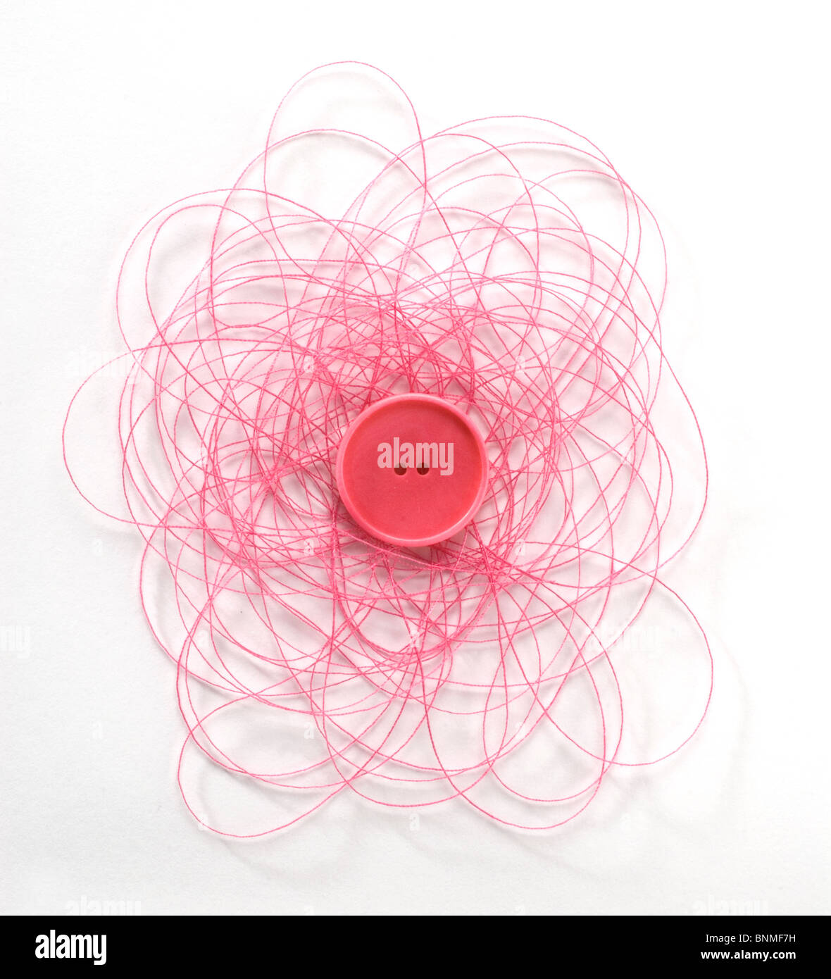 Button on string hi-res stock photography and images - Alamy