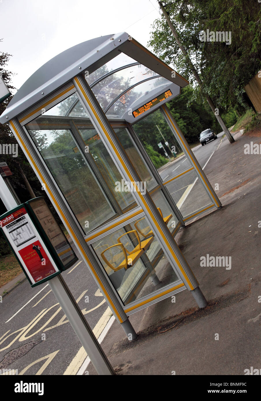 Bus stop with Electronic timetable Stock Photo - Alamy
