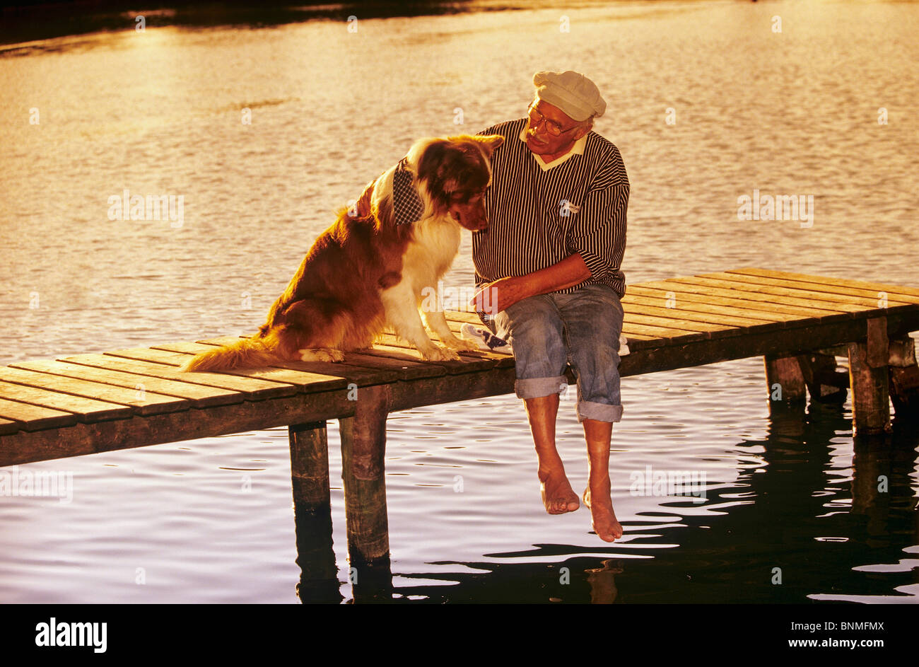Old man with a dog hi-res stock photography and images - Alamy