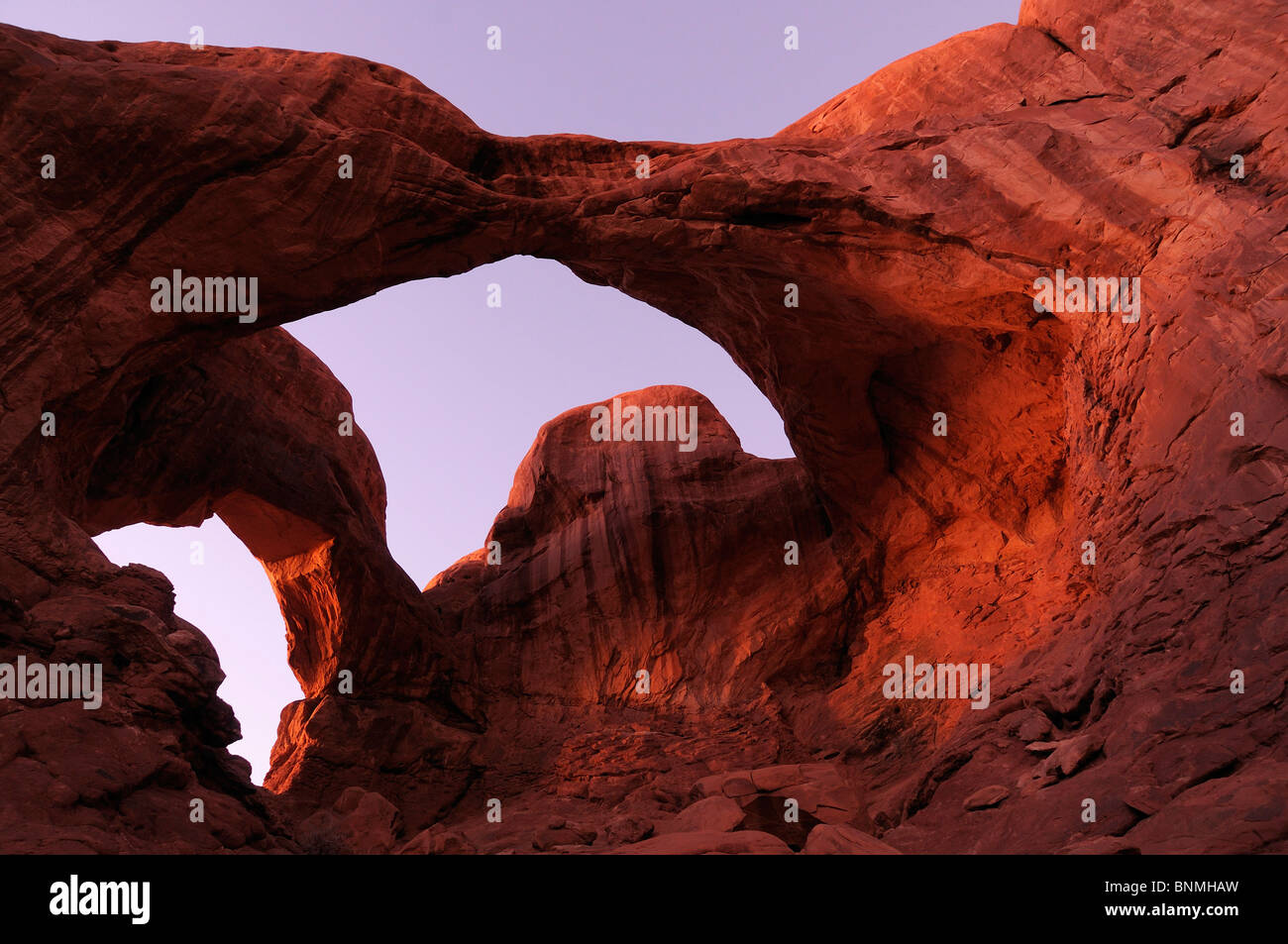 Double Arch Windows Section sunlight dawn early morning rock formations ...