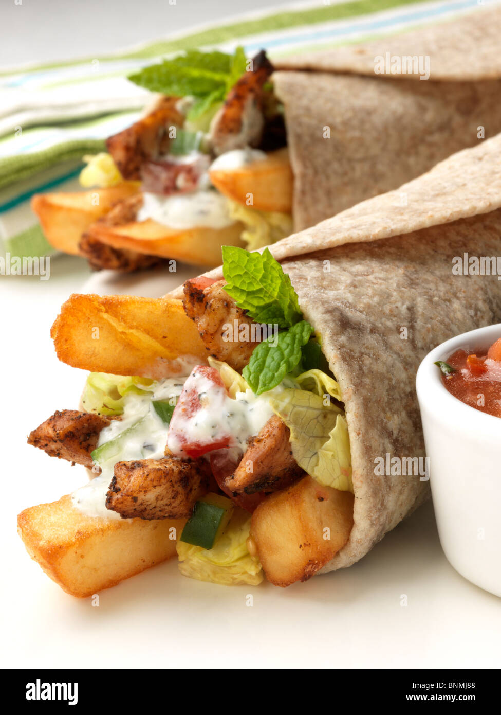 Chicken chapati wraps with chips fusion food Stock Photo - Alamy