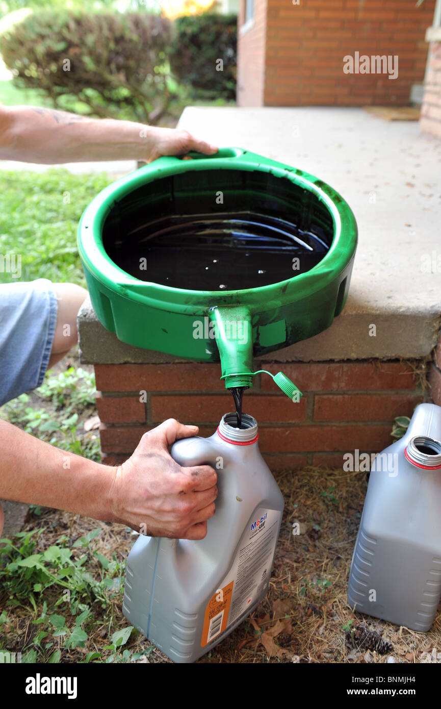 A man recycling motor oil Stock Photo - Alamy