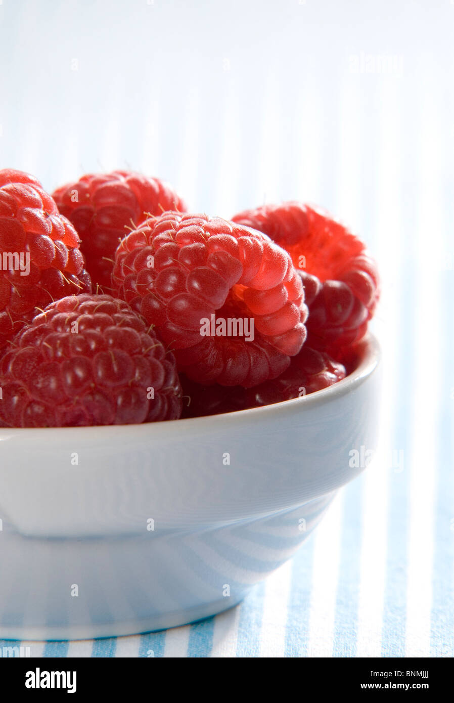 Red raspberries covered in hi-res stock photography and images - Alamy