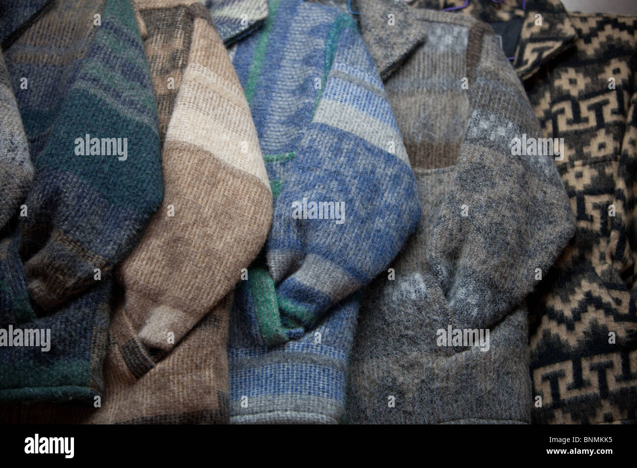 Alpaca jackets lined up for sale Stock Photo - Alamy