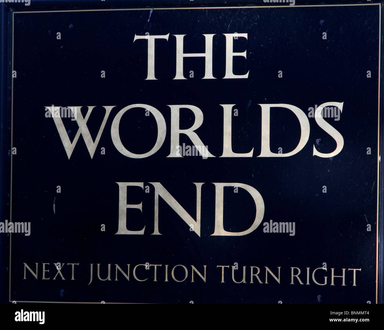 signpost to the world end next turn right - england Stock Photo - Alamy