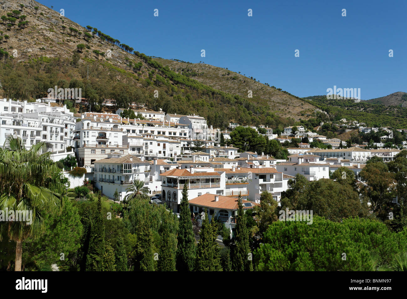 Spain Andalusia Mijas Pueblo local view trees mountains buildings ...