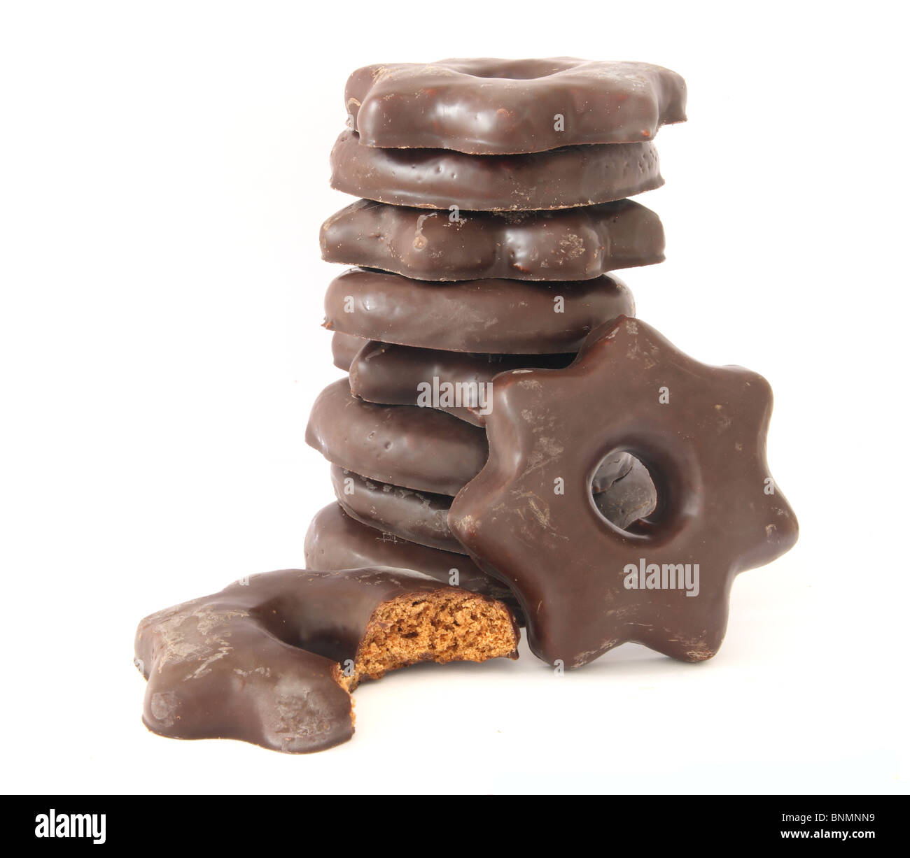 Stack of gingerbread cookies covered with chocolate, one bitten Stock ...