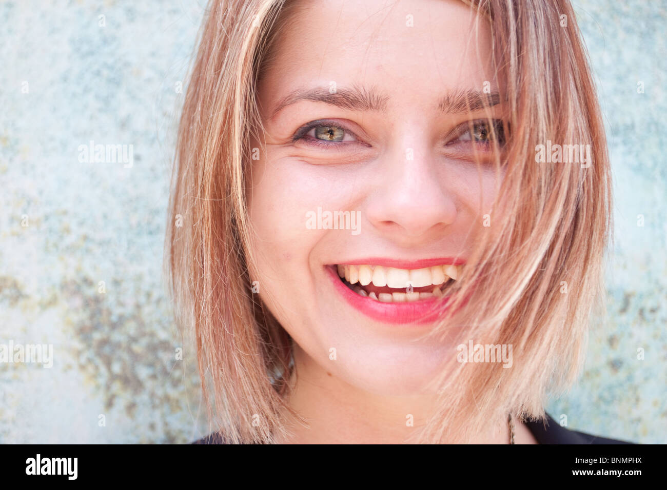 Big smile from happy blonde girl in the sun Stock Photo - Alamy
