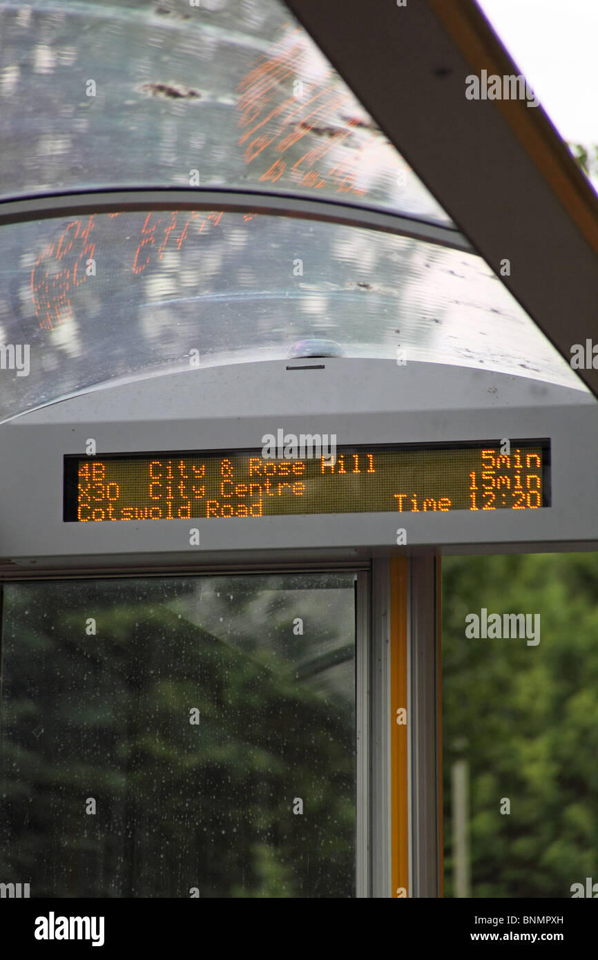 Bus stop with Electronic timetable Stock Photo - Alamy
