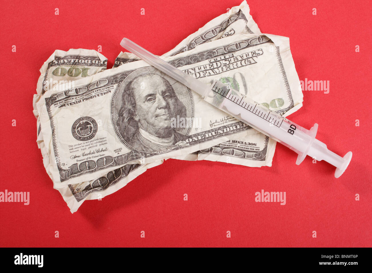Needle syringe dollar bill hi-res stock photography and images - Alamy