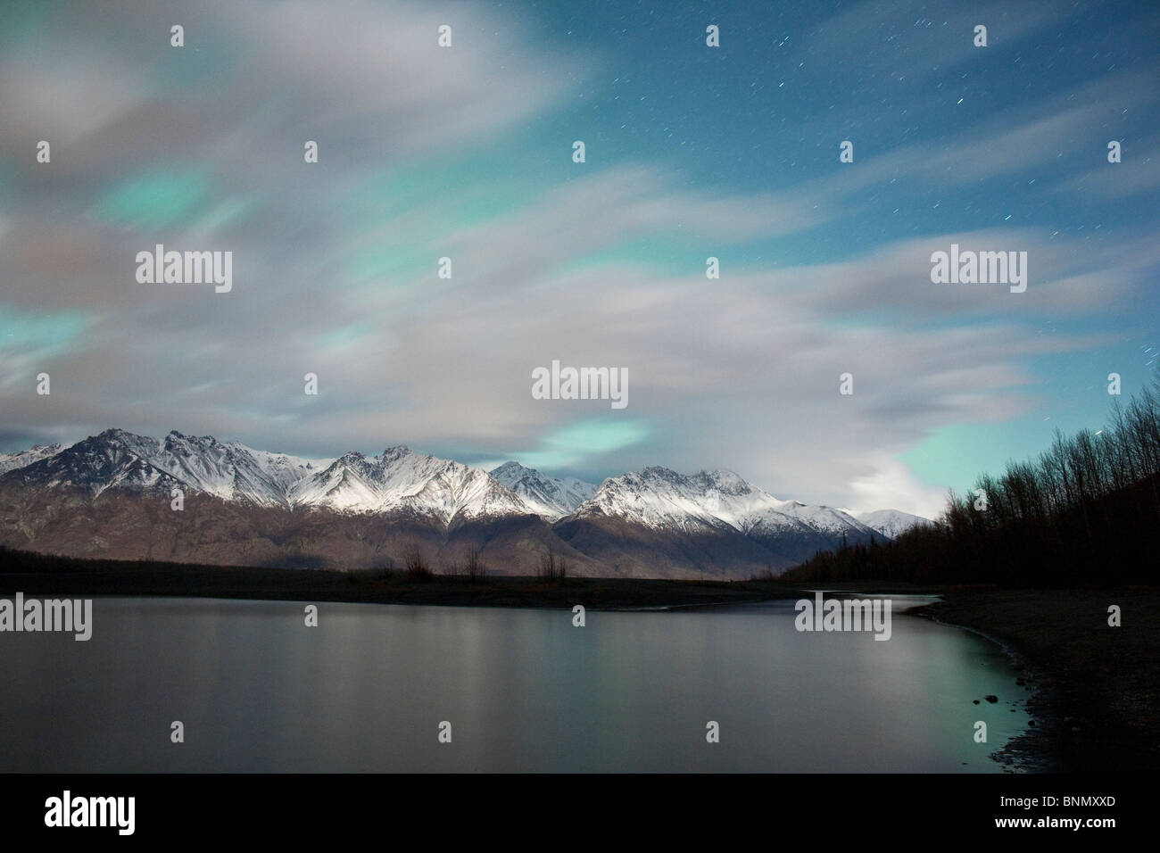 A long exposure of fast moving clouds moonlit night, Knik River Valley ...