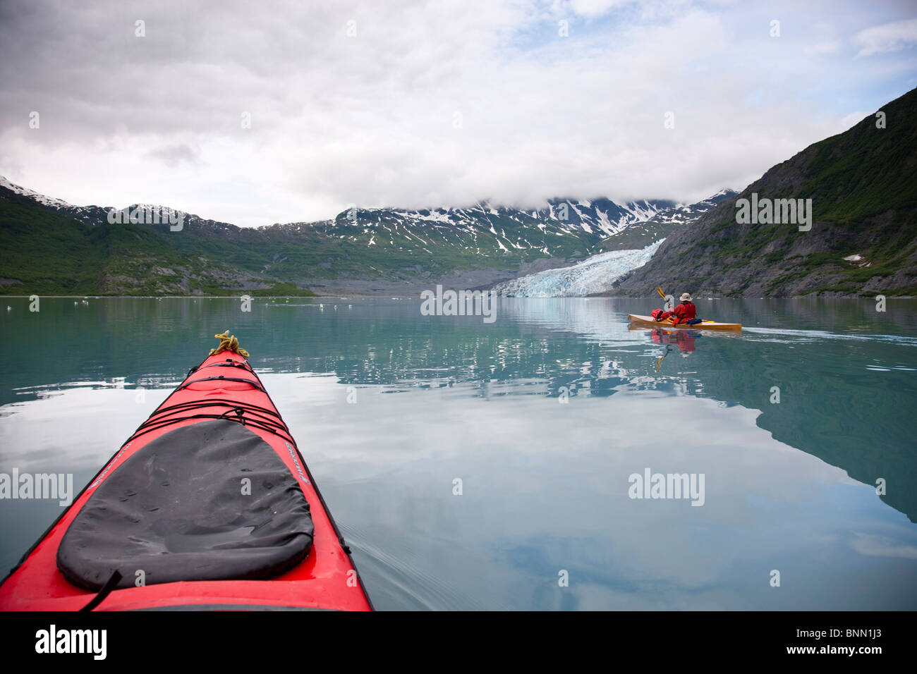 Man kayaking in Shoup Bay with Shoup Glacier in the background, Shoup ...