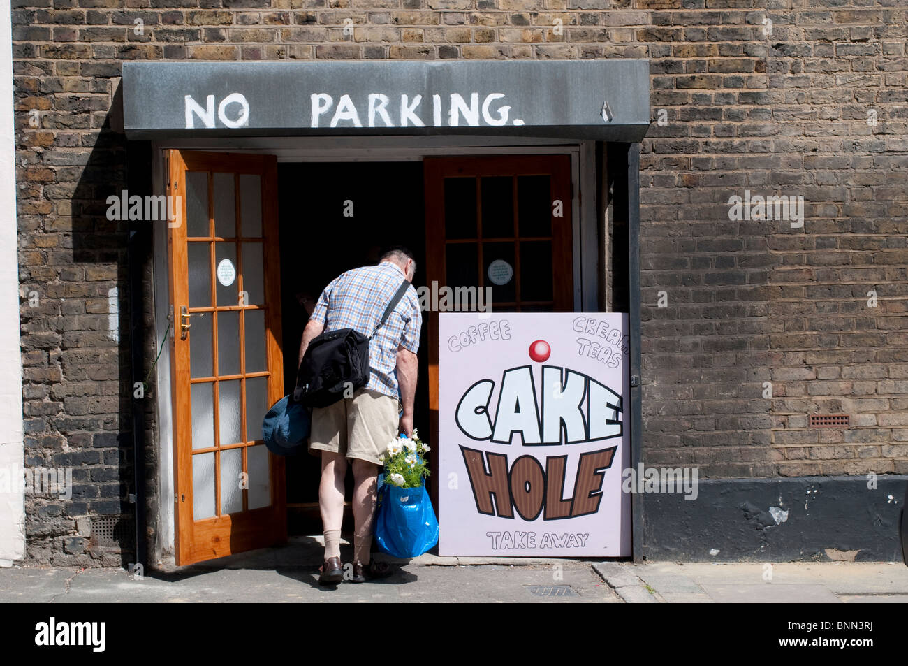 Man entering a cafe in East End, London, E2, England, UK Stock Photo ...