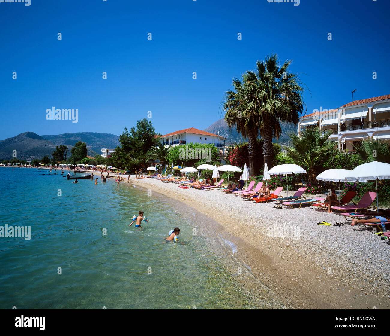 Beach scene at the picturesque resort of Nidri on the Greek island of ...