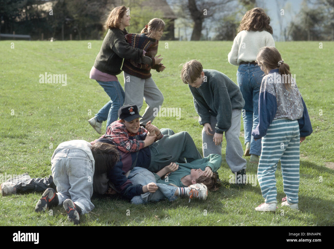 children playing on a field Stock Photo - Alamy