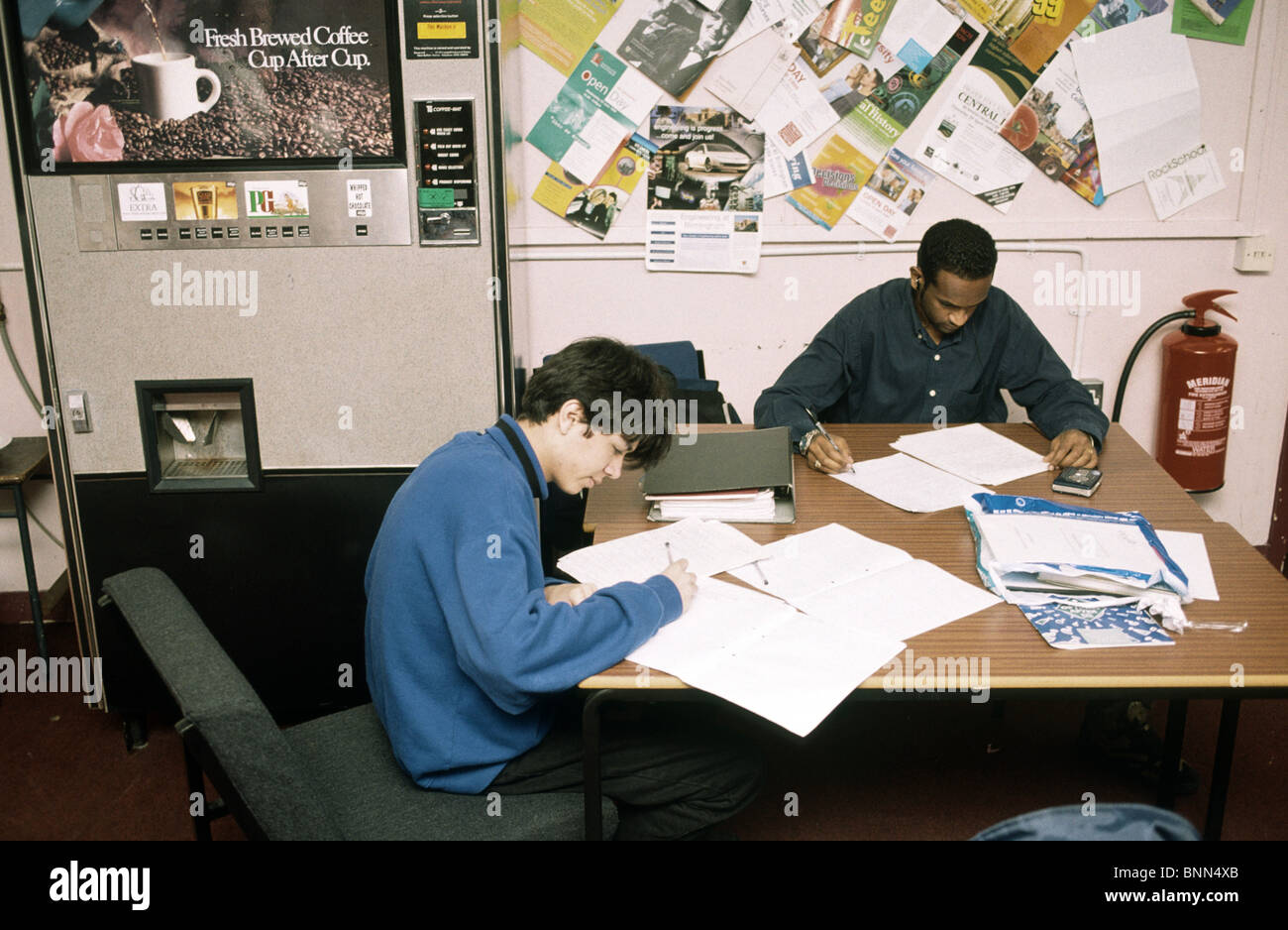 Secondary common room with students studying Stock Photo - Alamy