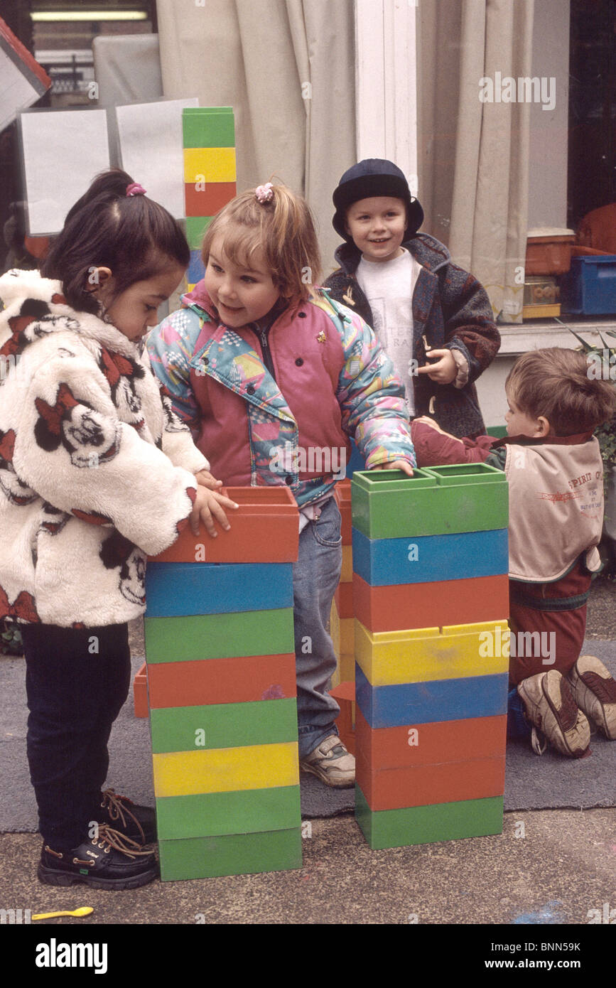 primary school children playing with big building blocks in the school ...