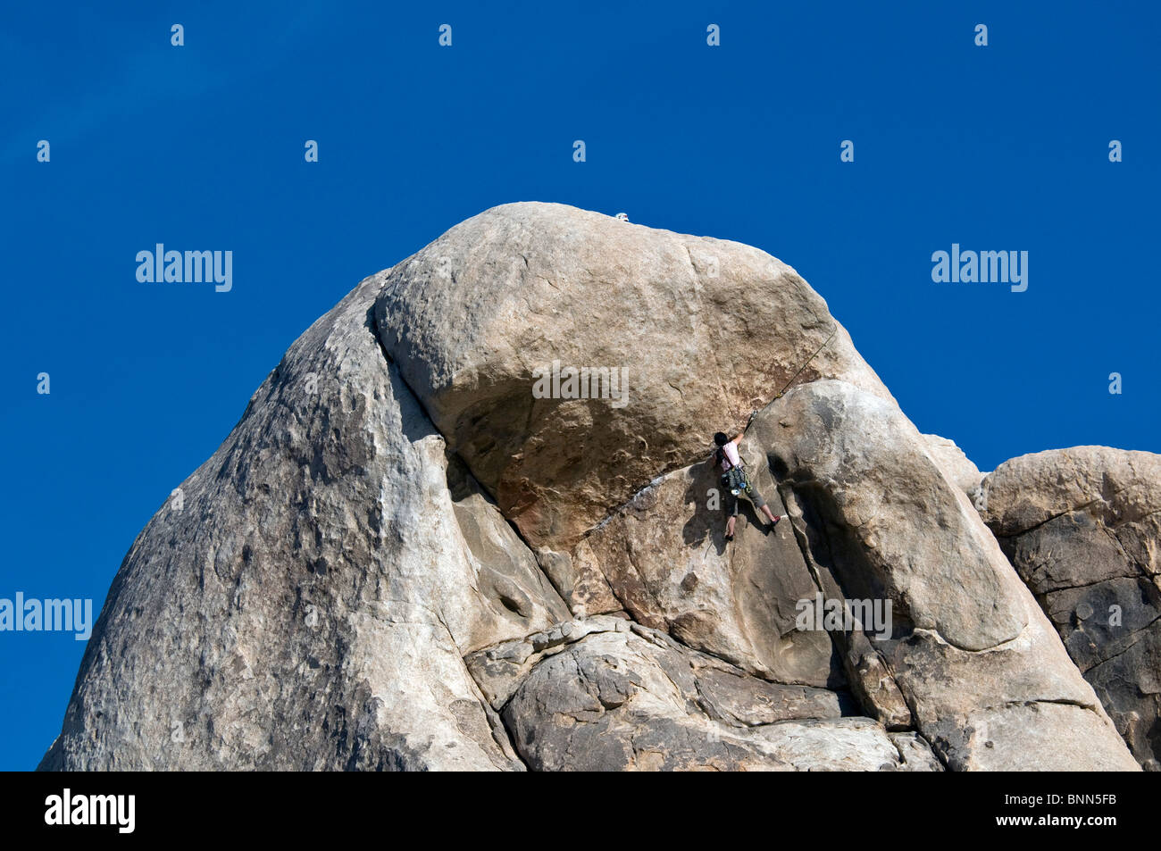 climbing rock climber rock rock face one person woman rope monzonite ...
