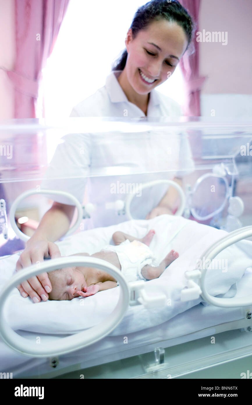 Nurse and premature baby Stock Photo - Alamy
