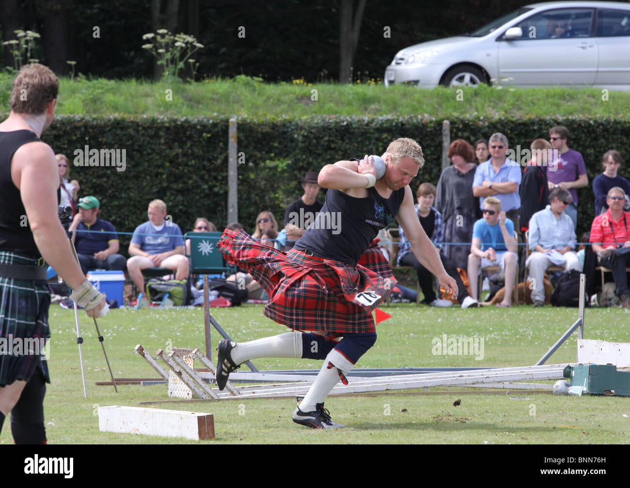 man competing in highland games Stone put St Andrews Scotland 2010 ...