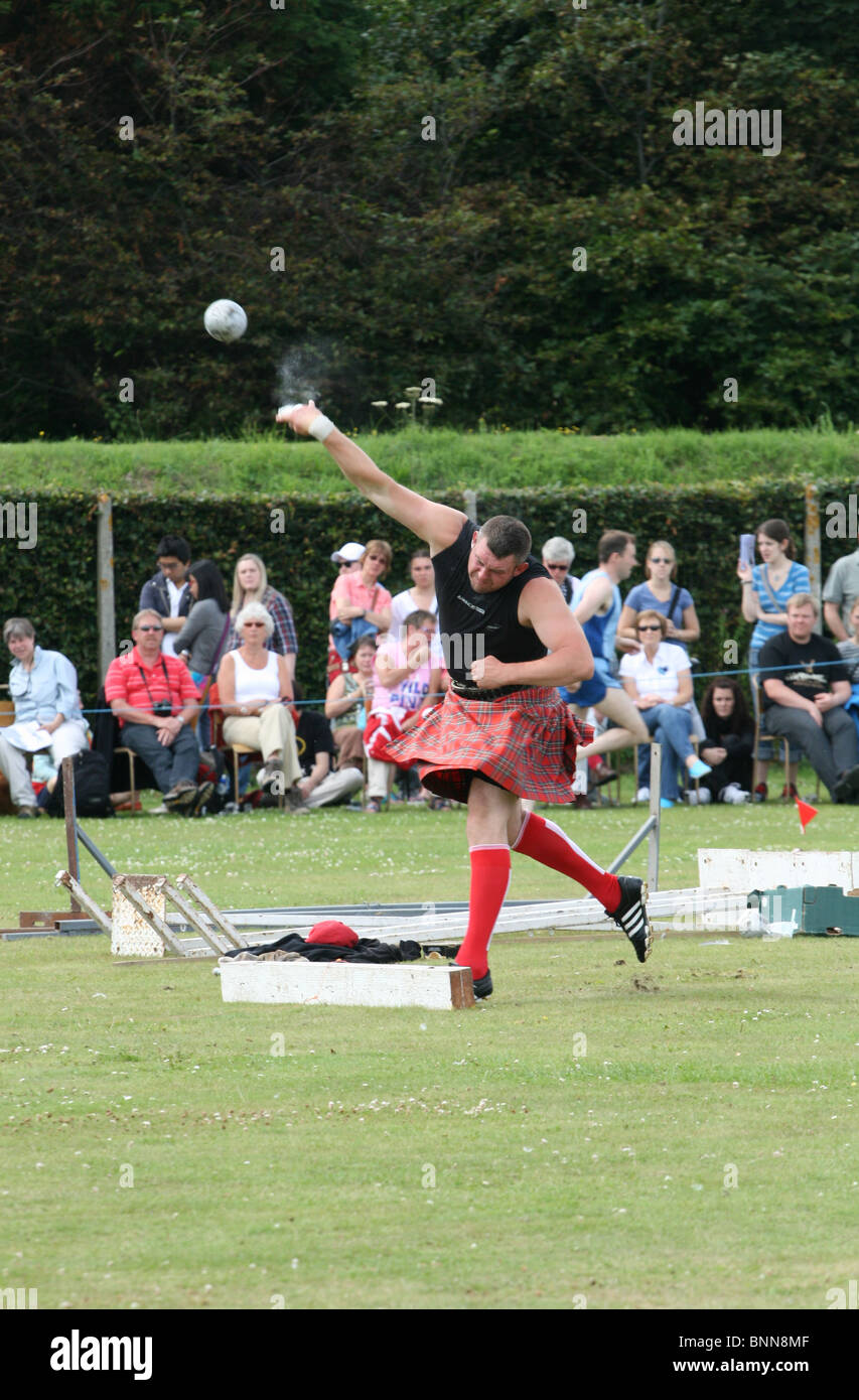 man competing in Stone put highland games St Andrews Scotland 2010 ...