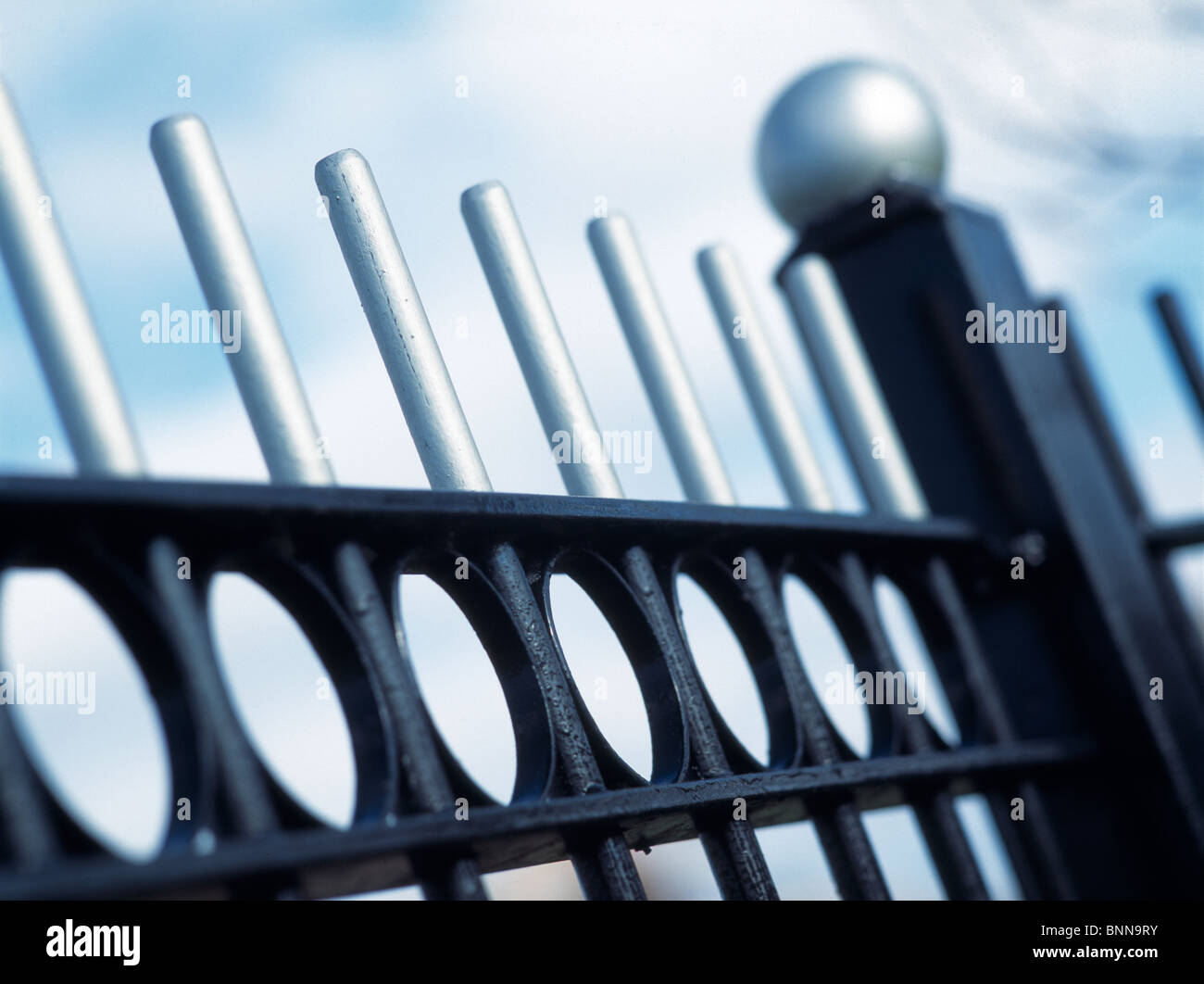 Detail of iron railings against a blue sky Stock Photo - Alamy