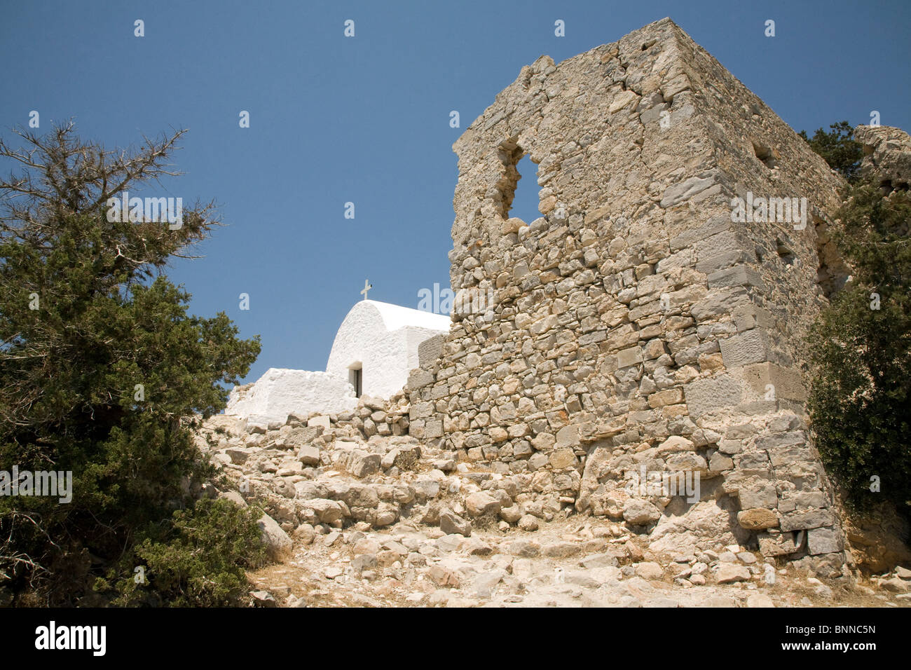 Castle walls and whitewashed Greek orthodox church, Kastrou Monolithos ...