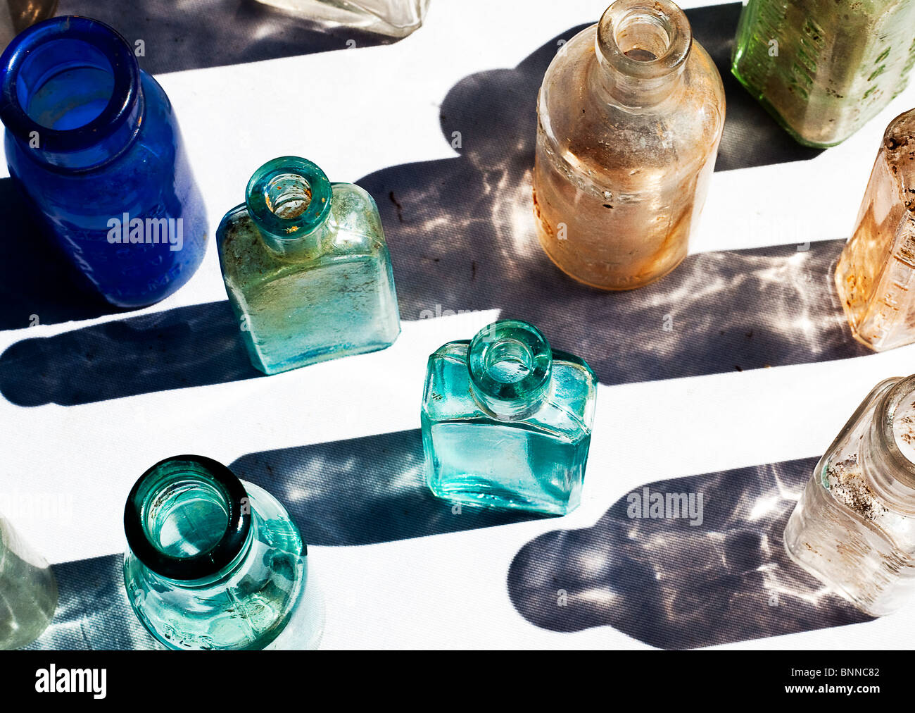 Antique bottles in assorted colors Stock Photo - Alamy