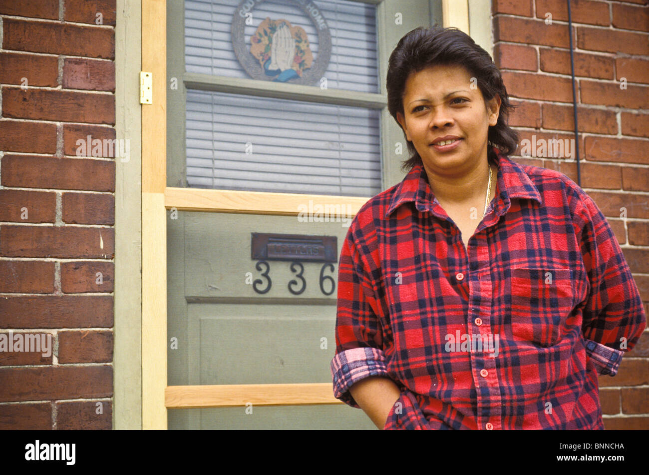 One young hispanic female outside house Stock Photo - Alamy