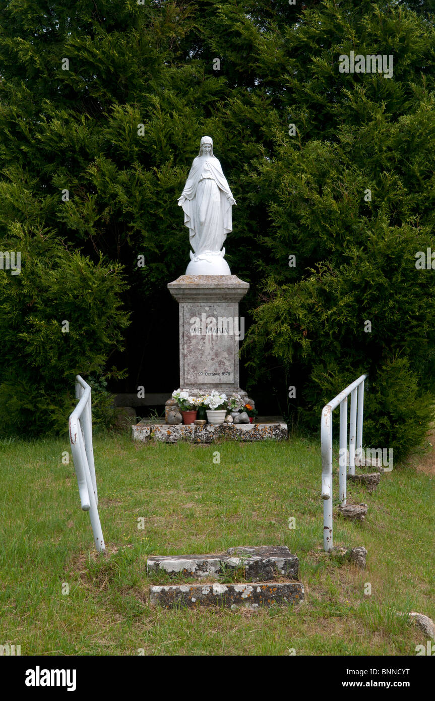 Statue of the Virgin Mary, with Ave Maria written across the pillar, at ...
