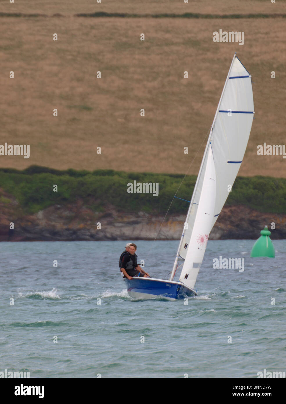 Two teenage boys sailing, Camel Estuary, Padstow, Cornwall, UK Stock ...