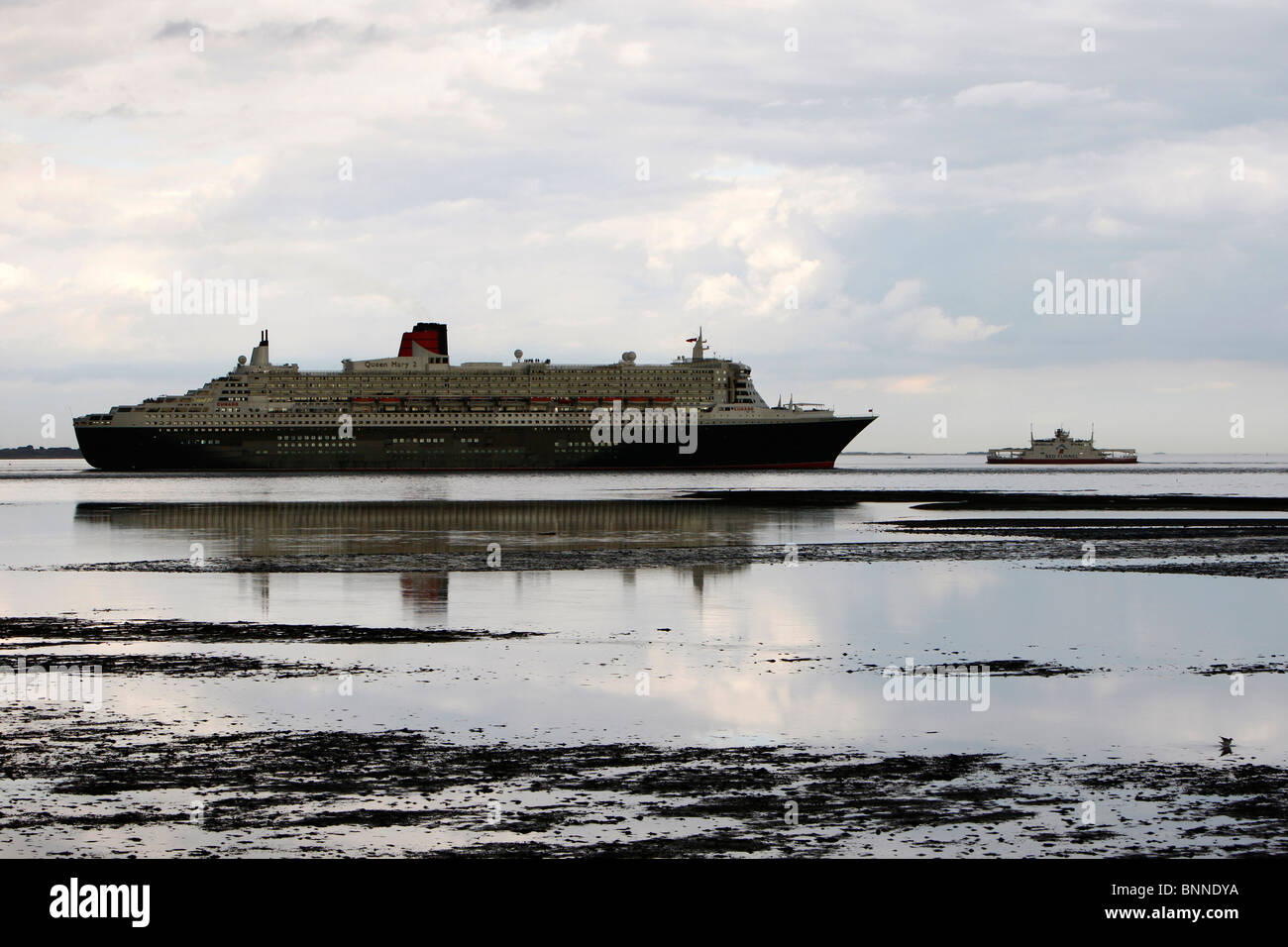 The Queen Mary 2 passing the Isle of Wight ferry on way to Norway Stock ...