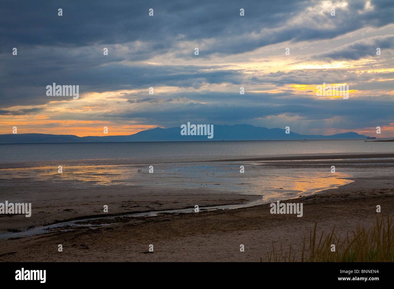 Sunset over Isle of Arran Stock Photo - Alamy