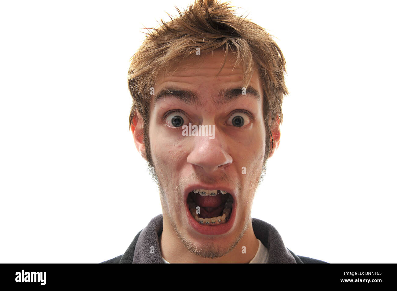 Man isolated on white screaming for his life Stock Photo - Alamy