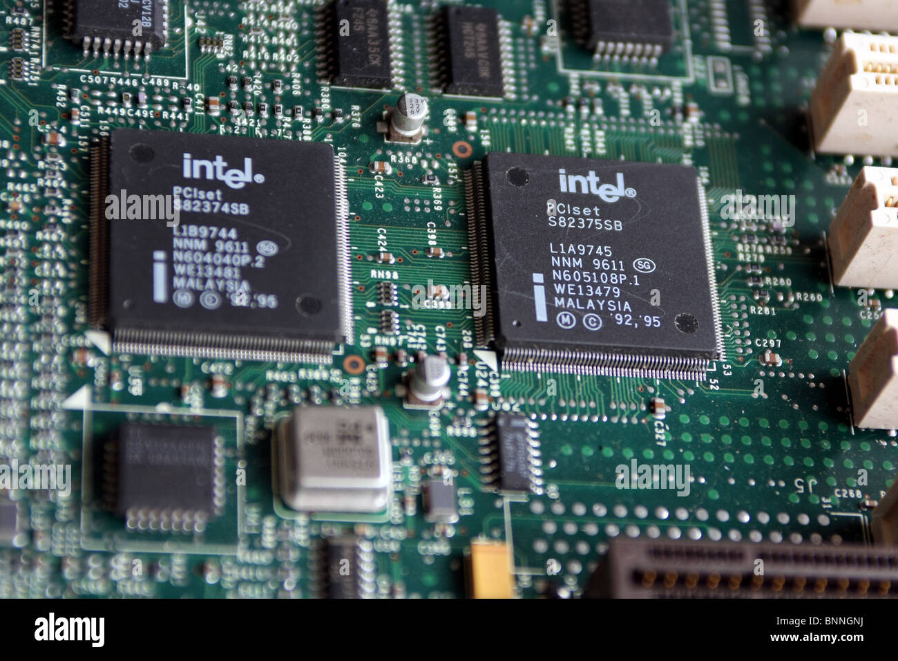Two Intel PCI CPU controllers on a Dell computer system board Stock ...
