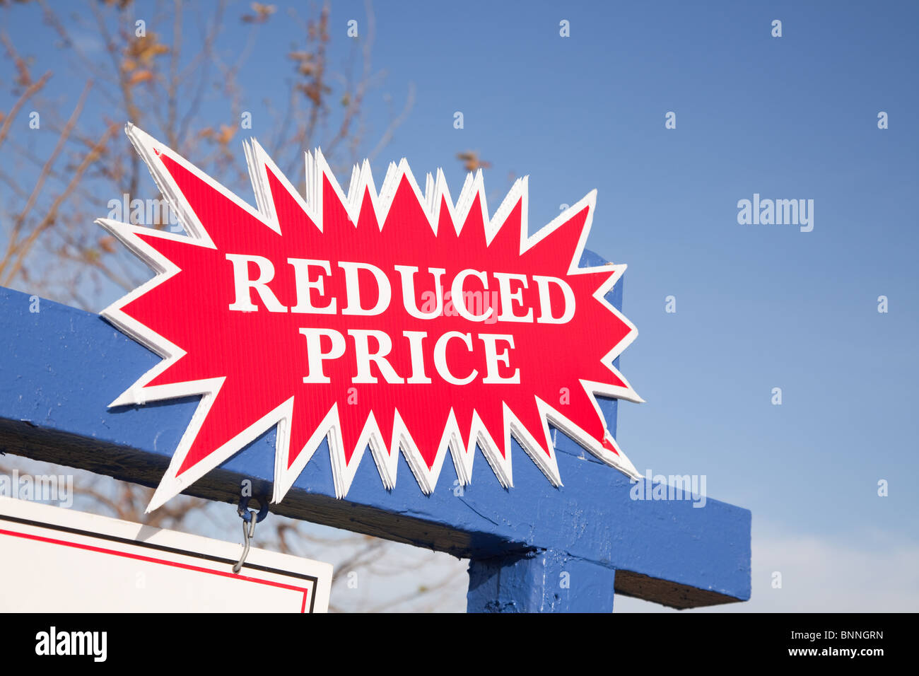 Red Reduced Price Burst Real Estate Sign Stock Photo - Alamy