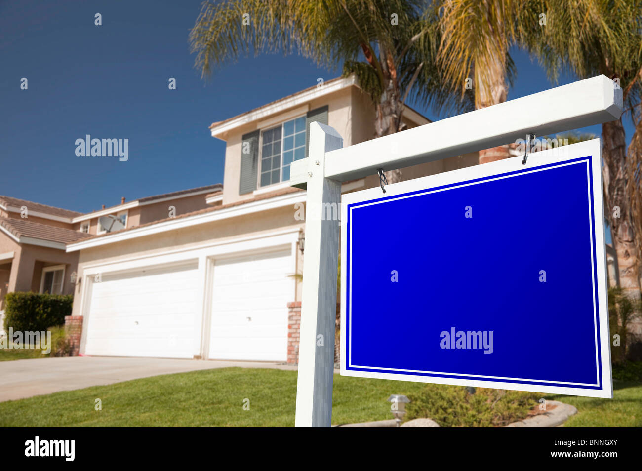 Blank Real Estate Sign in Front of House Stock Photo - Alamy