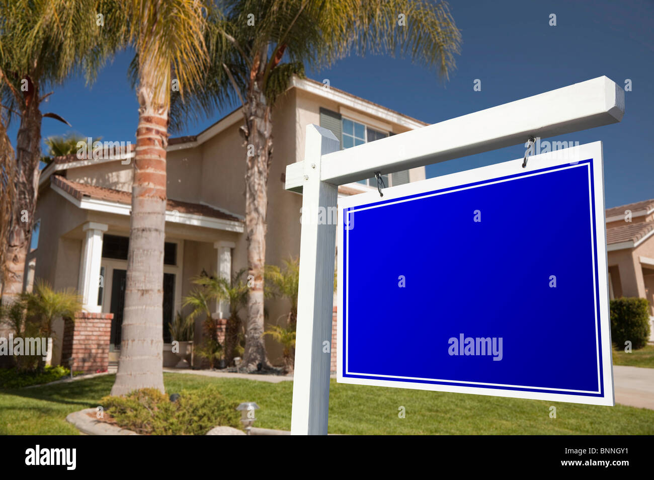 Blank Real Estate Sign in Front of House Stock Photo - Alamy